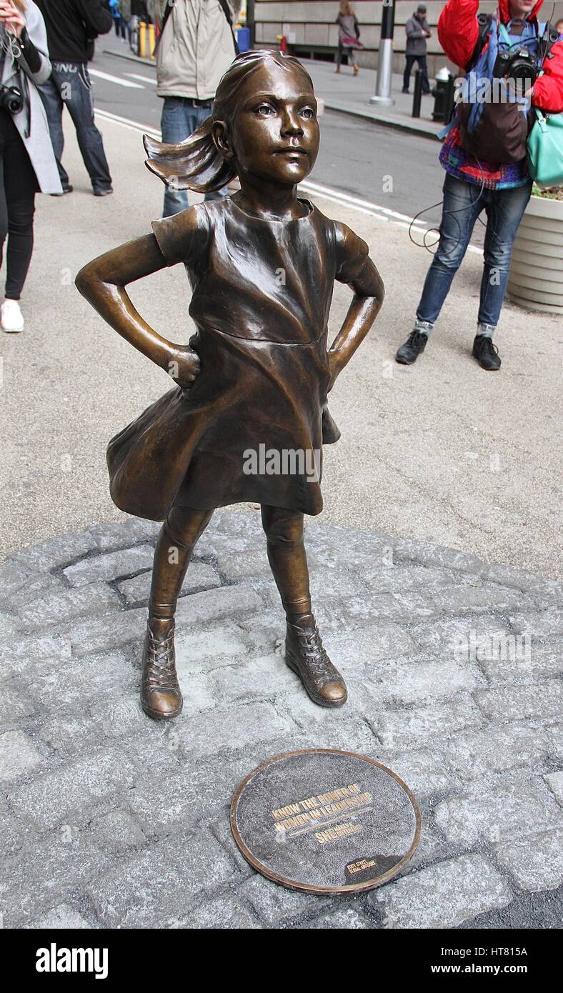 New York, NY, USA. 8th Mar, 2017. Bronze statue of young girl staring ...