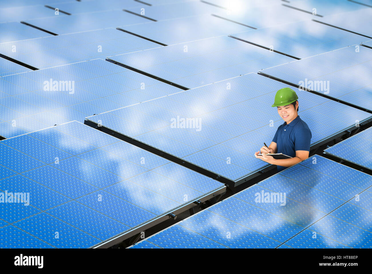 solar panel technician with blue solar panel station Stock Photo - Alamy
