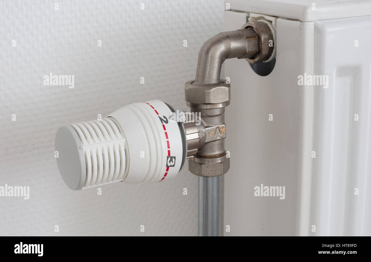 Temperature knob of heating radiator, used and dusty - 2 Stock Photo ...