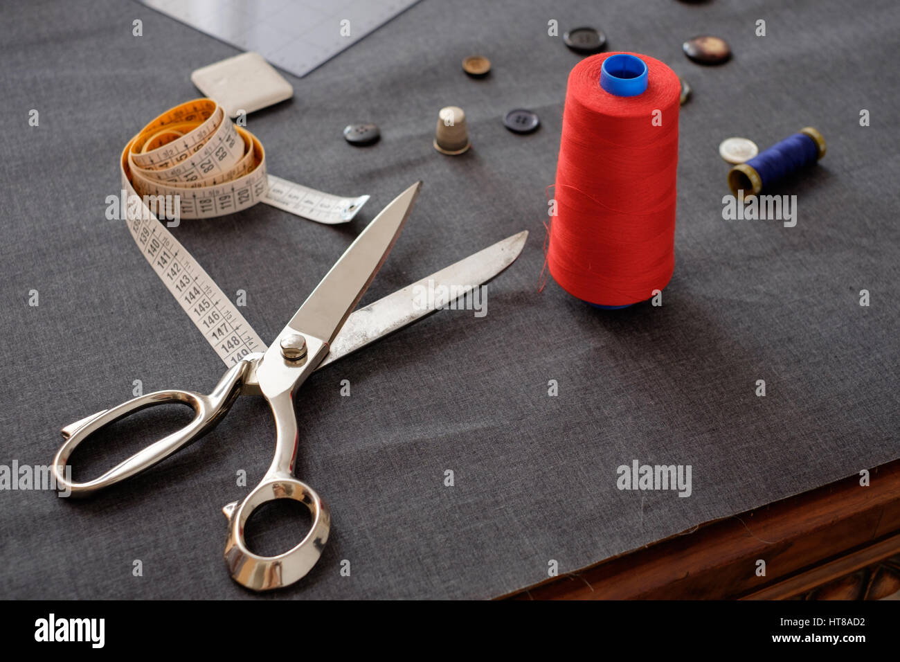 Tailor tools isolated on piece of fabric background Stock Photo - Alamy