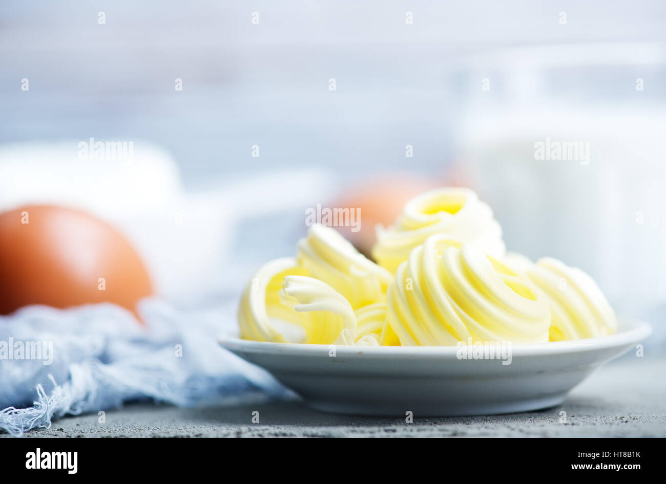butter on plate and on a table Stock Photo - Alamy