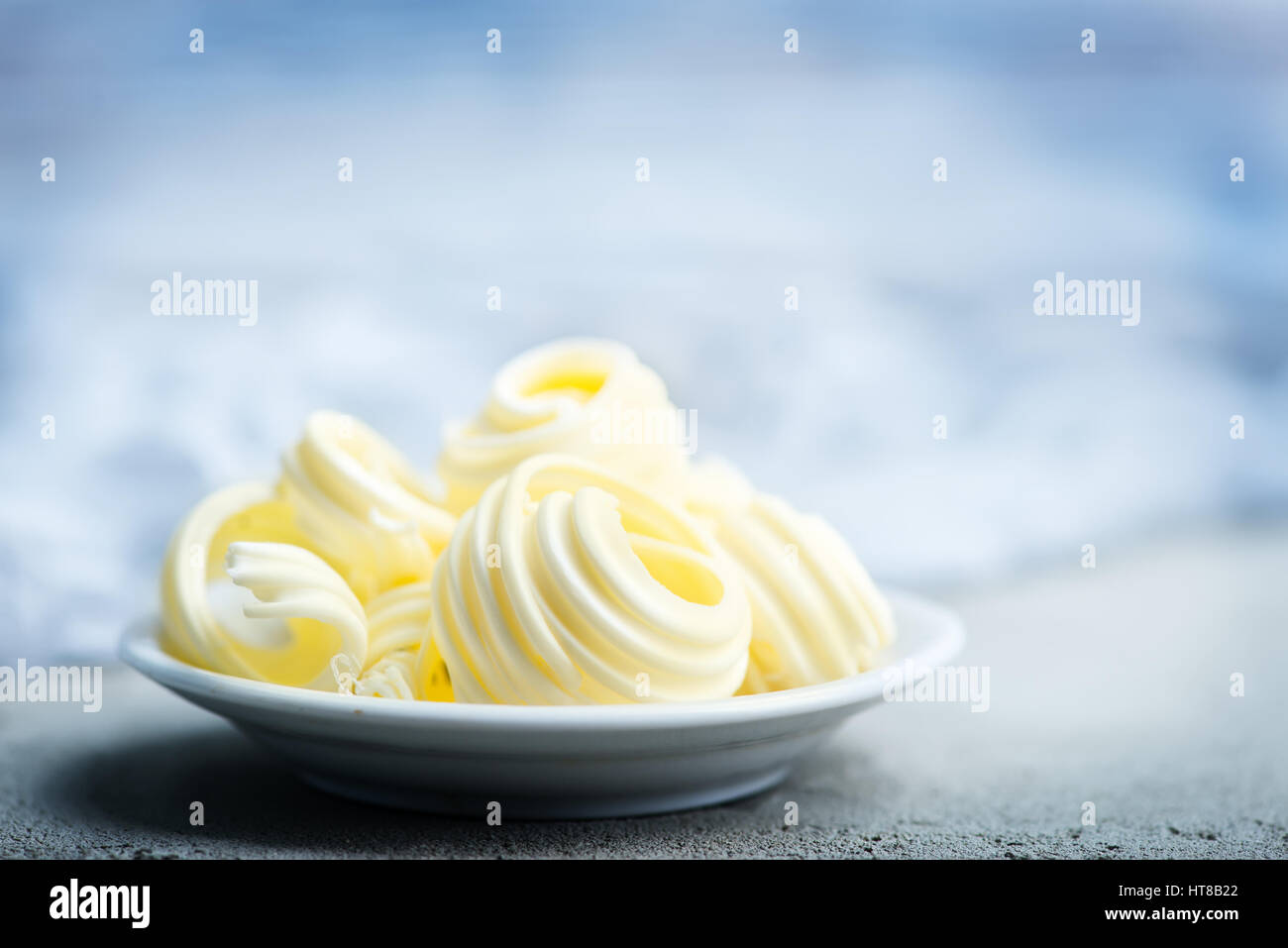 butter on plate and on a table Stock Photo - Alamy