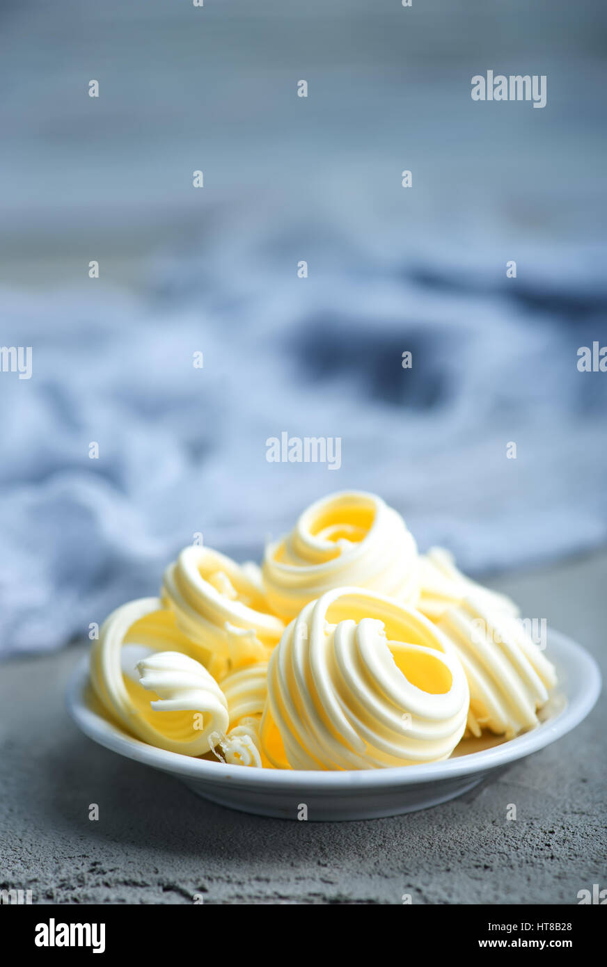 butter on plate and on a table Stock Photo - Alamy