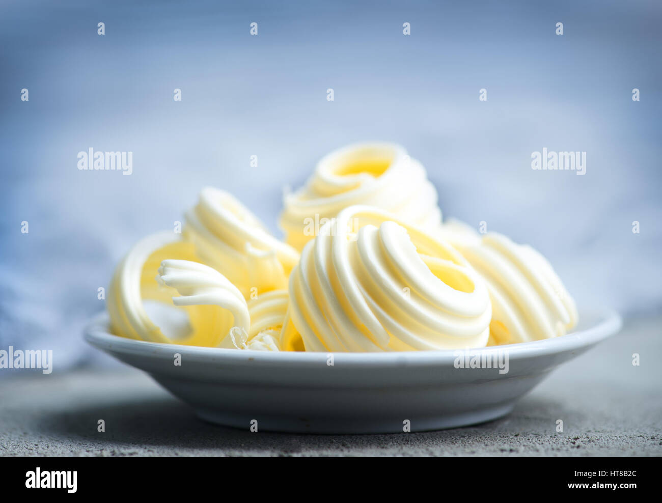 butter on plate and on a table Stock Photo - Alamy