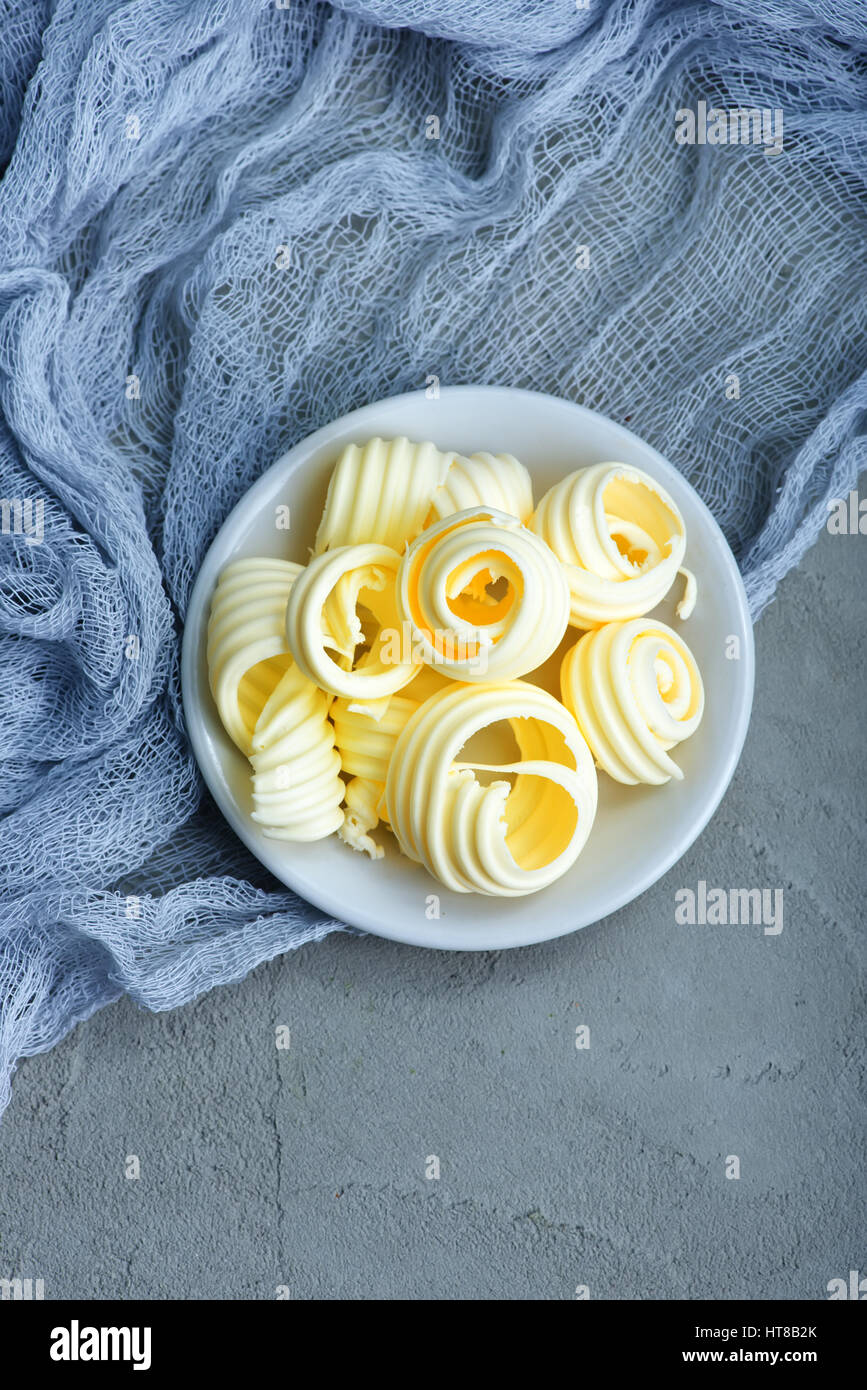 butter on plate and on a table Stock Photo - Alamy