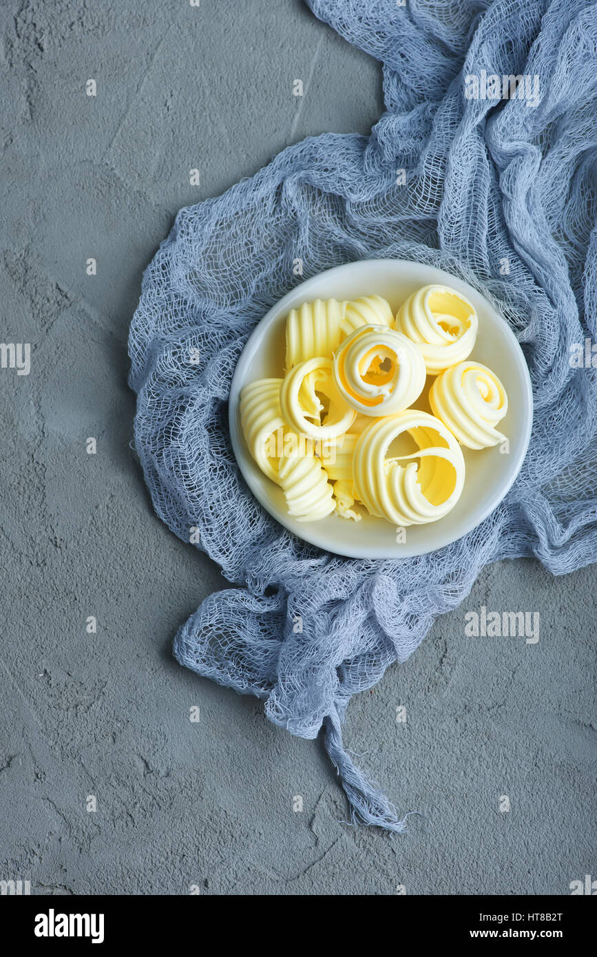 butter on plate and on a table Stock Photo - Alamy