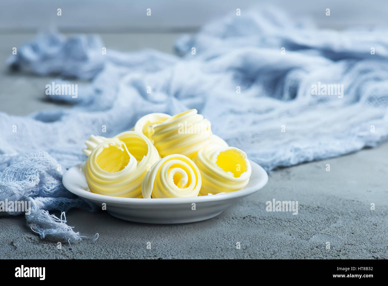 butter on plate and on a table Stock Photo - Alamy
