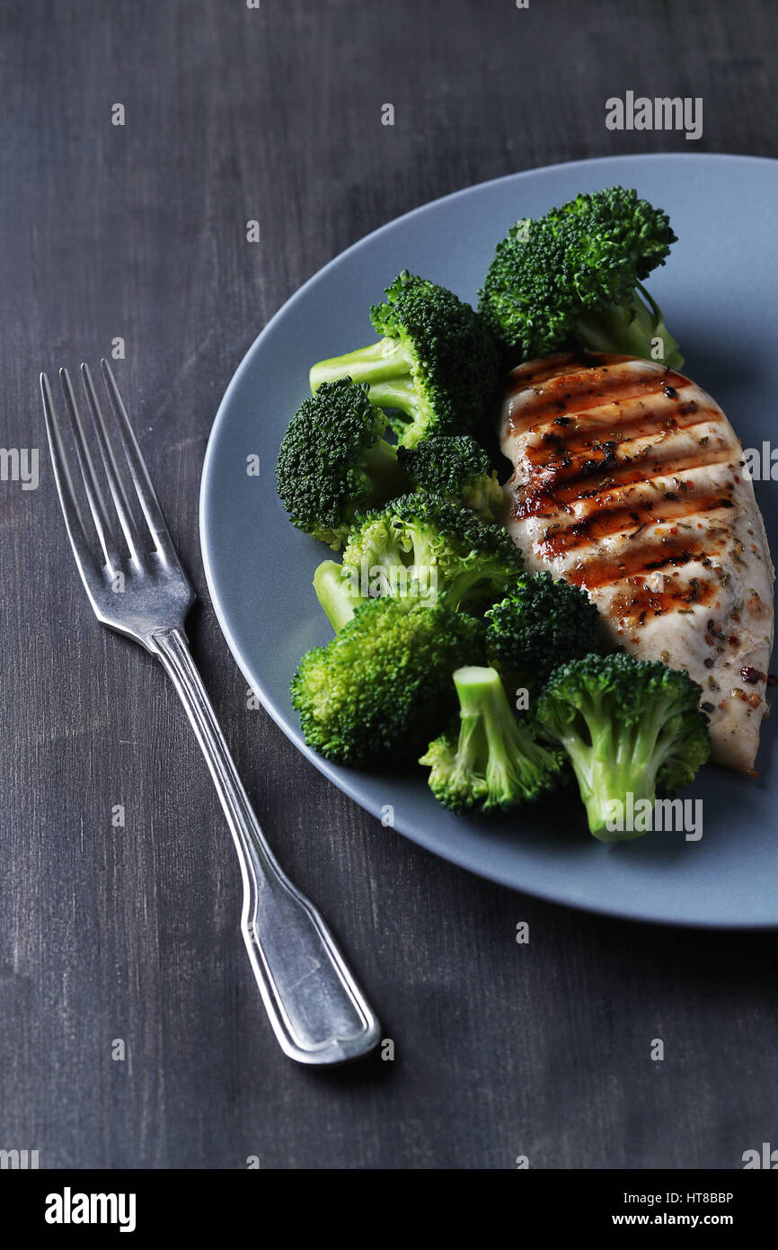 Dinner. Fried chicken fillet with vegetables Stock Photo - Alamy