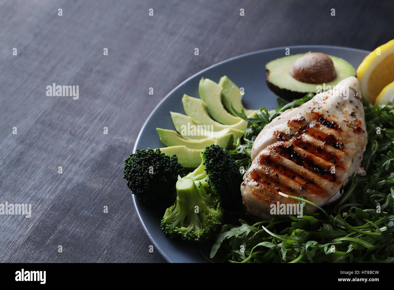 Dinner. Fried chicken fillet with vegetables Stock Photo - Alamy