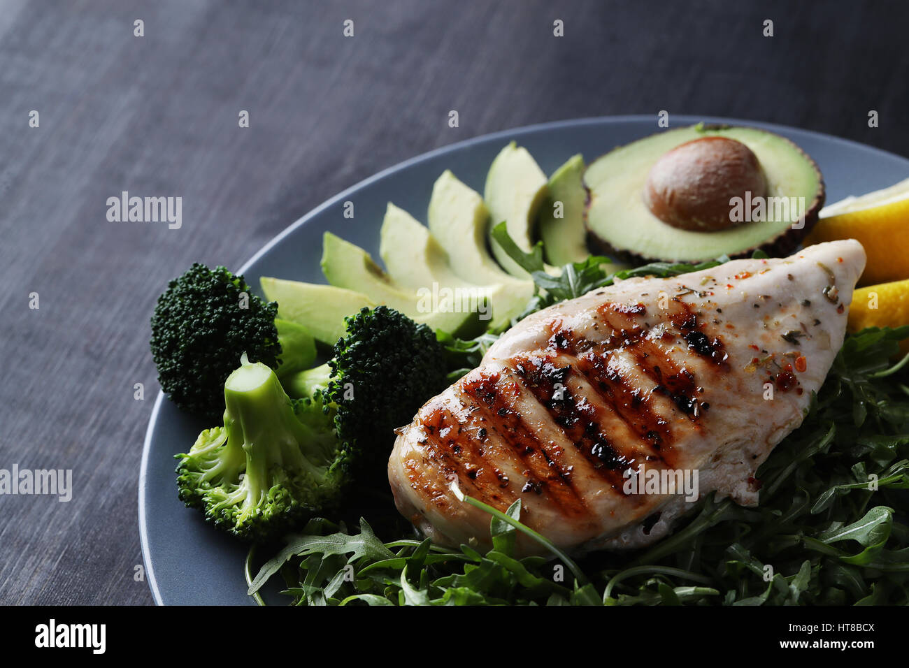Dinner. Fried chicken fillet with vegetables Stock Photo - Alamy
