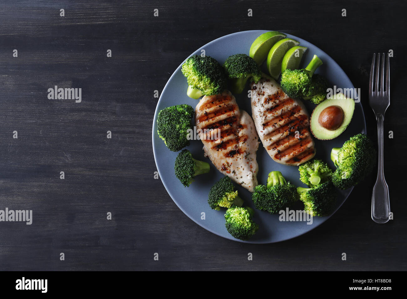 Dinner. Fried chicken fillet with vegetables Stock Photo - Alamy