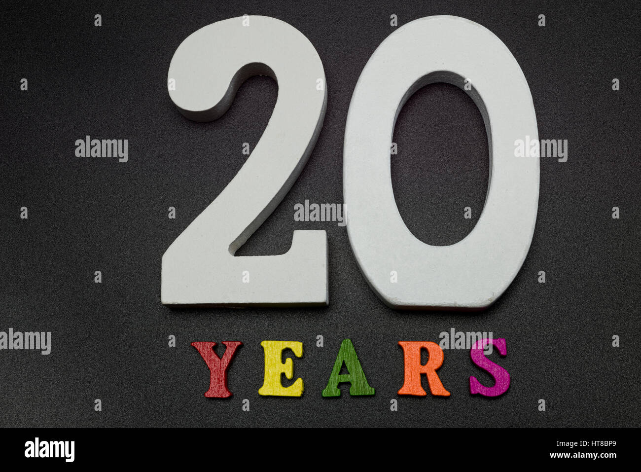 Twenty years of large white numerals on a black background Stock Photo ...