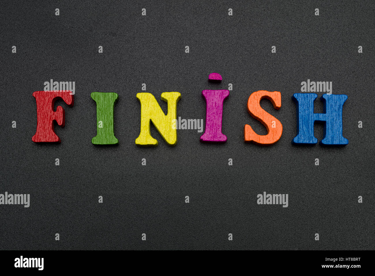 The finish on a black background lined with letters Stock Photo - Alamy