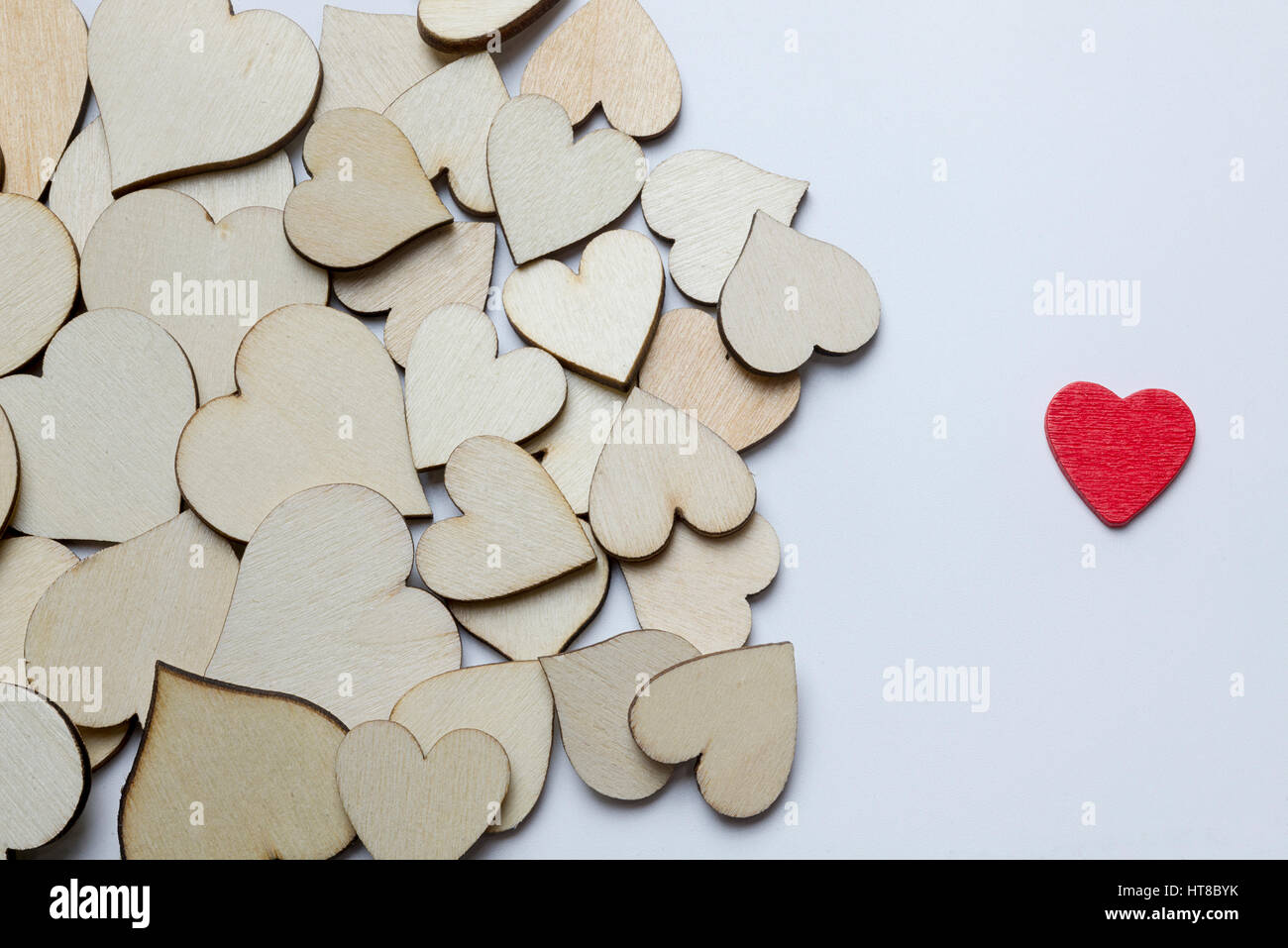 Red heart around a lot of white Stock Photo - Alamy