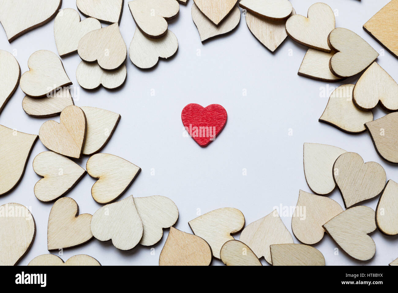 Red heart around a lot of white Stock Photo - Alamy