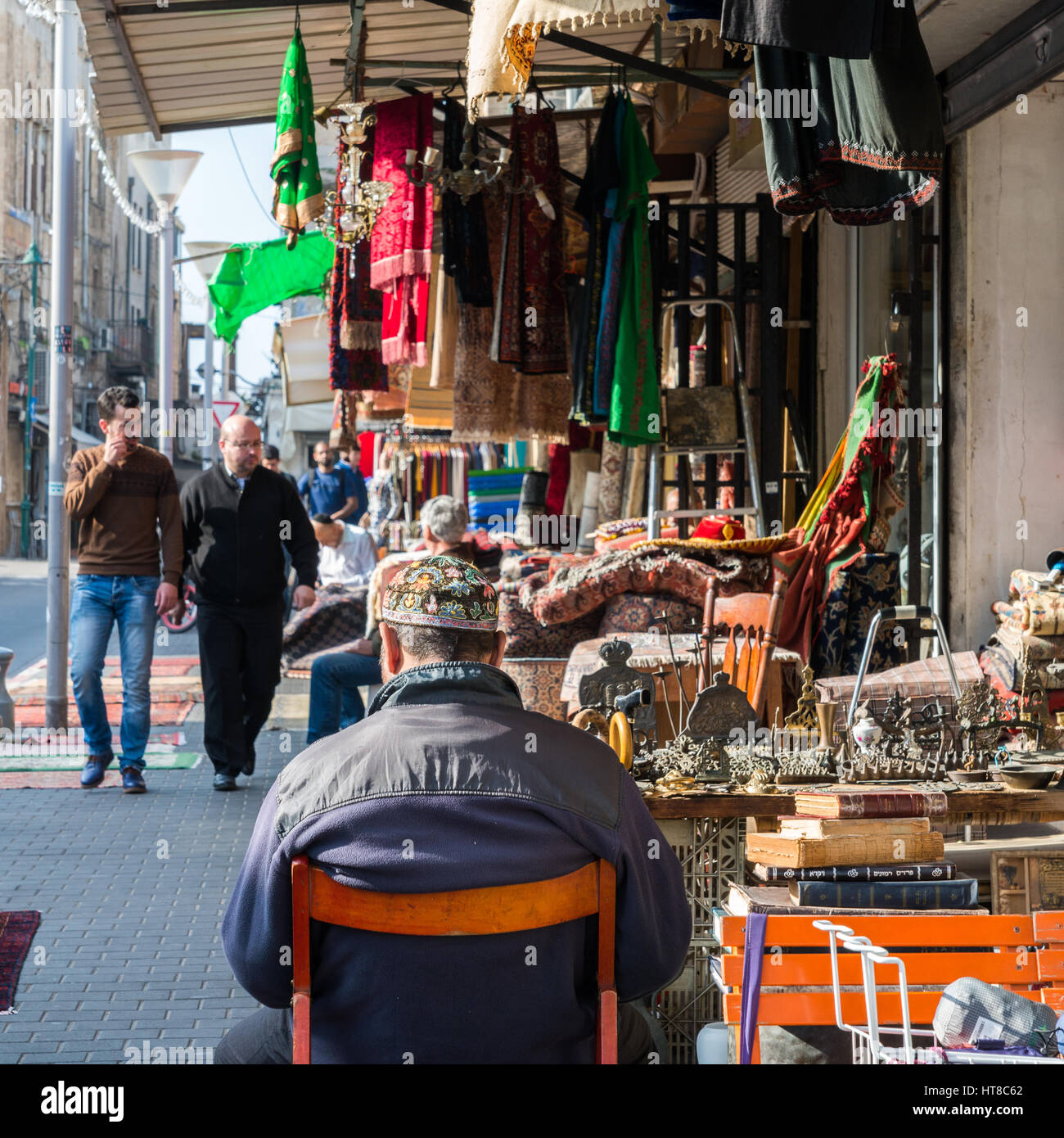 Man fixing a carpet, Jaffa, Israel Stock Photo - Alamy