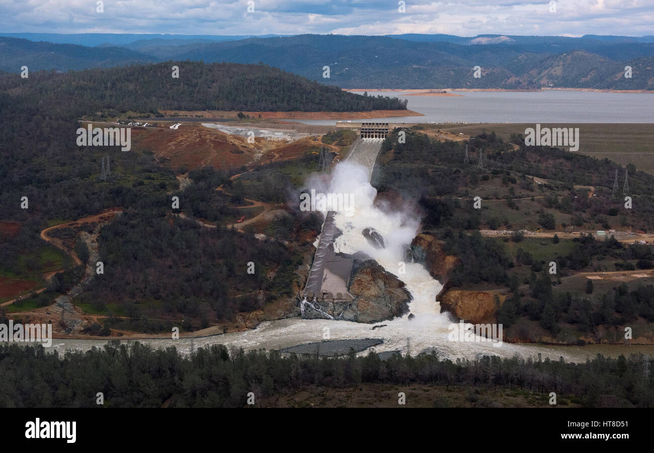 Aerial view showing the damaged spillway spilling massive volumes of ...