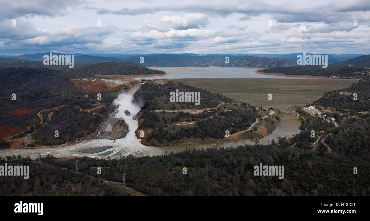 Aerial view showing the damaged spillway spilling massive volumes of ...
