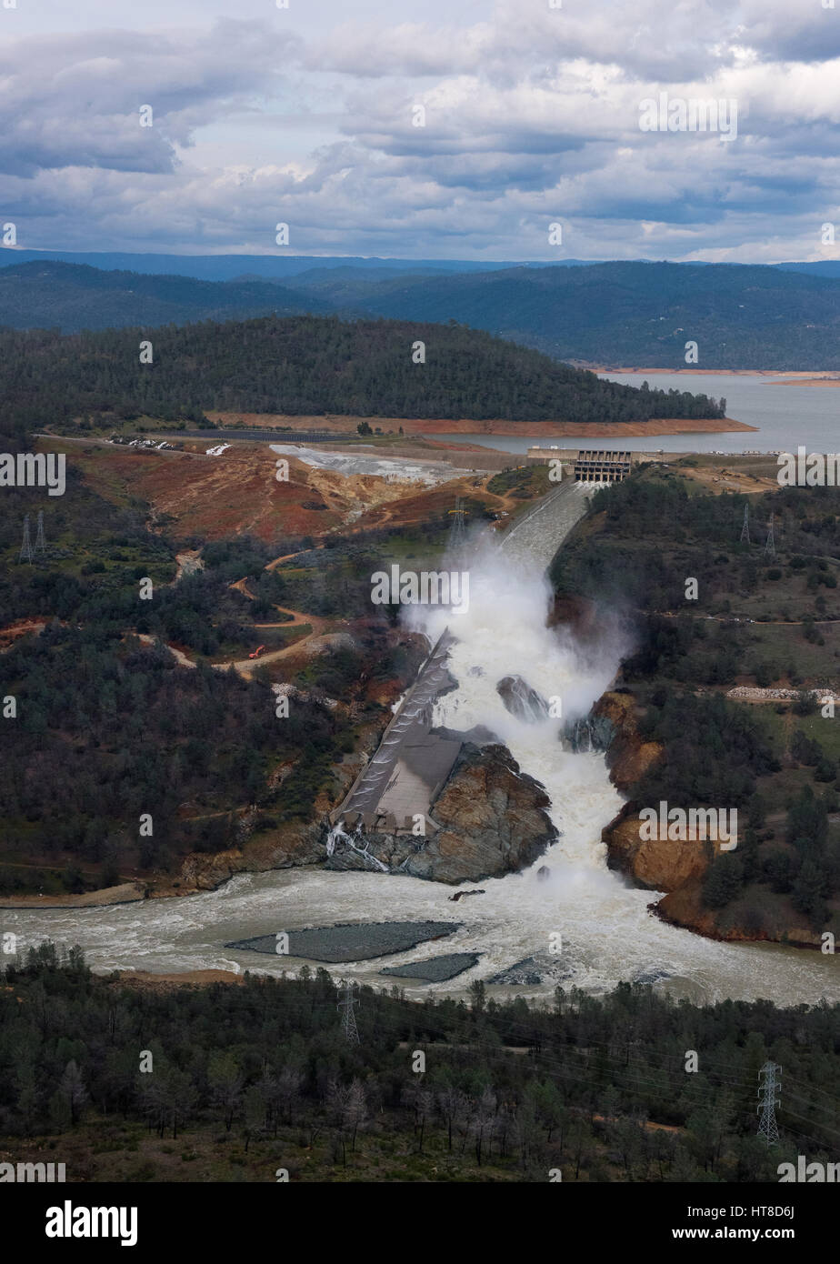Aerial view showing the damaged spillway spilling massive volumes of ...