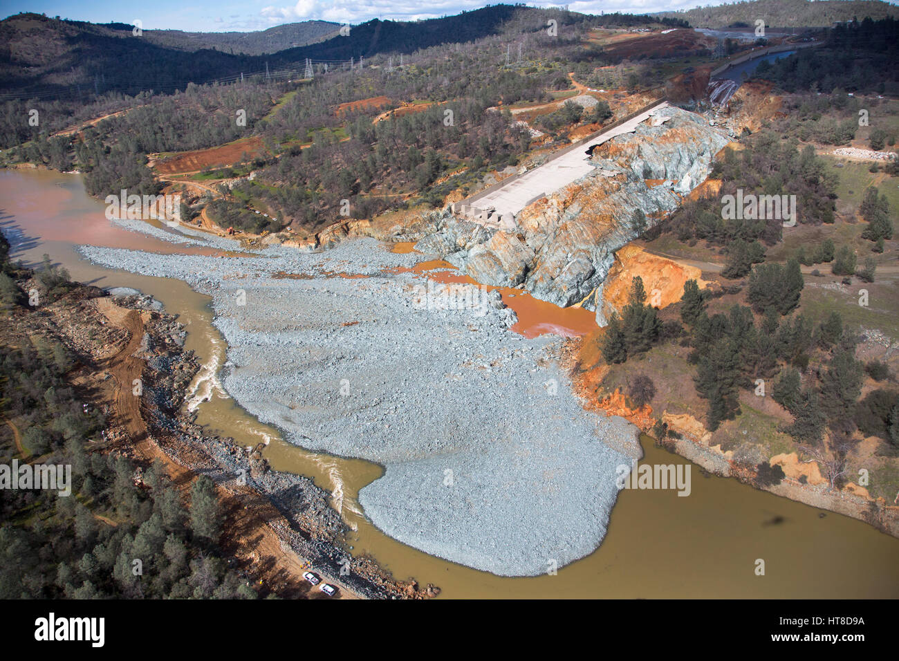 Aerial view showing the damaged spillway and and the huge debris field ...