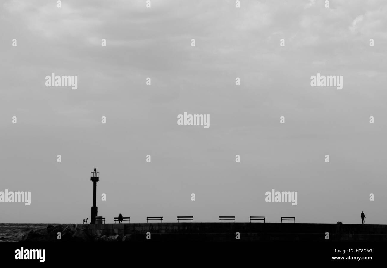 Human silhouettes on the dock Stock Photo - Alamy