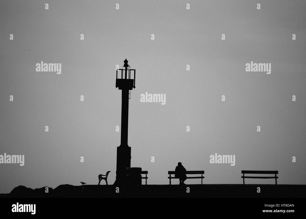 Human silhouettes on the dock Stock Photo - Alamy