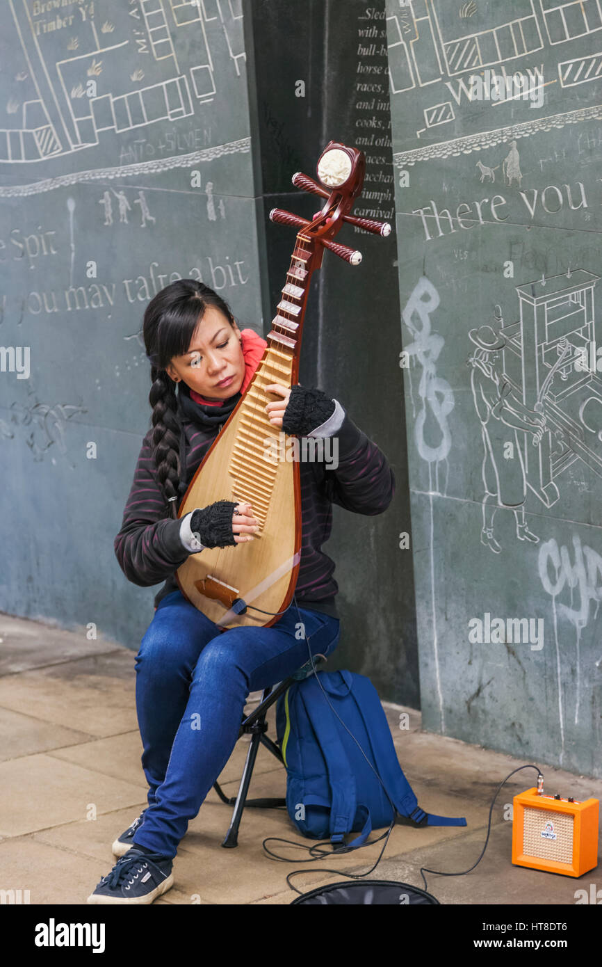 England, London, Southwark, Bankside, Female Chinese Busker Playing ...