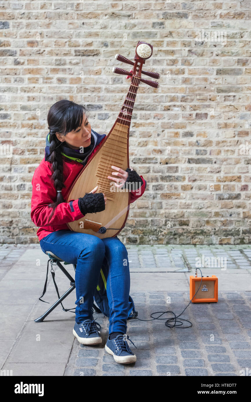 England, London, Southwark, Bankside, Female Chinese Busker Playing ...
