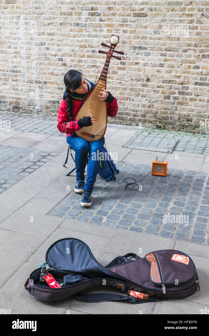 England, London, Southwark, Bankside, Female Chinese Busker Playing ...