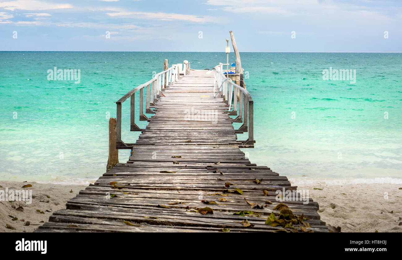 Wooden dock leading into Thailand seaside tropical paradise Stock Photo ...