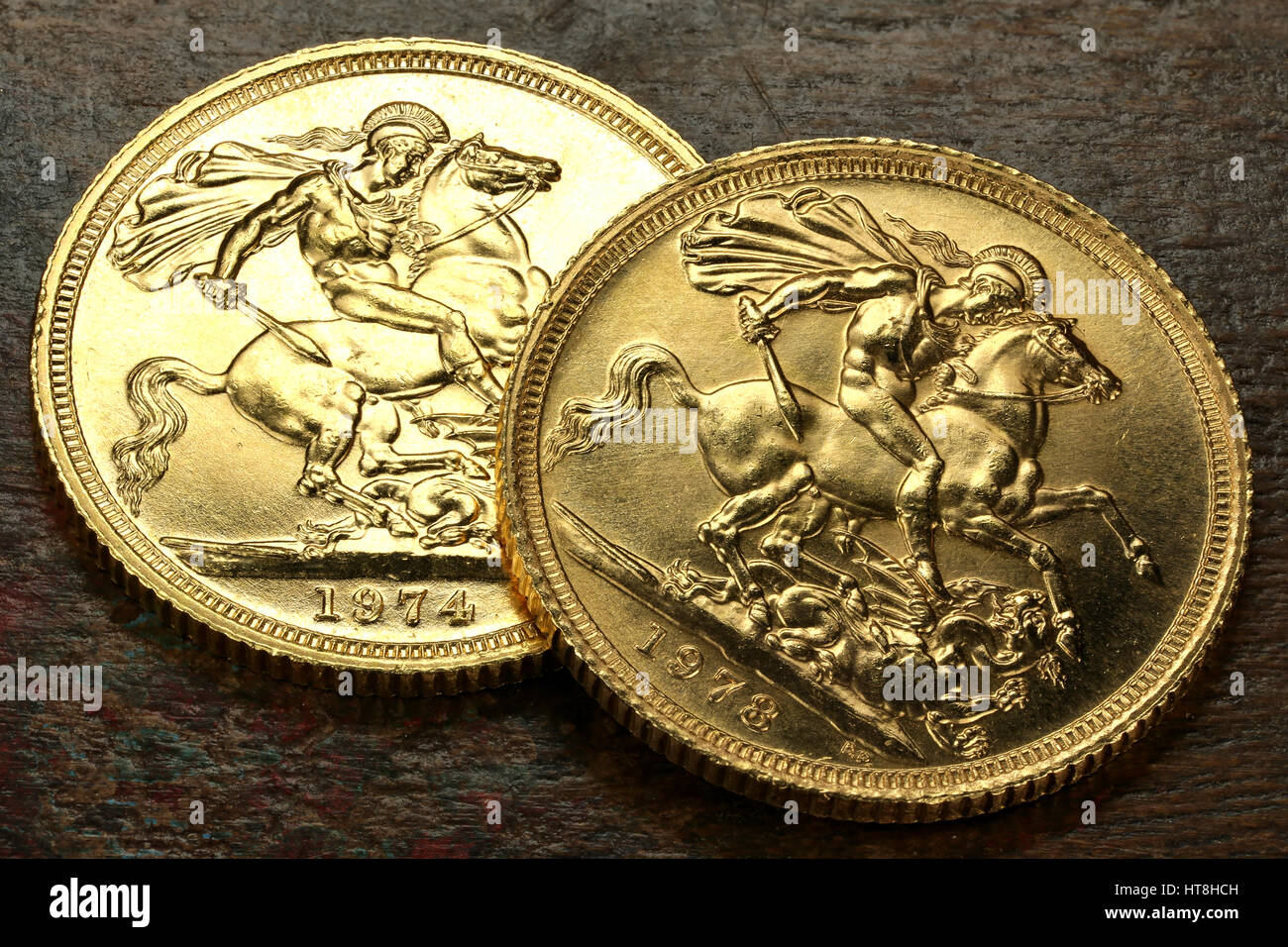 British Sovereign gold coins on rustic wooden background Stock Photo ...