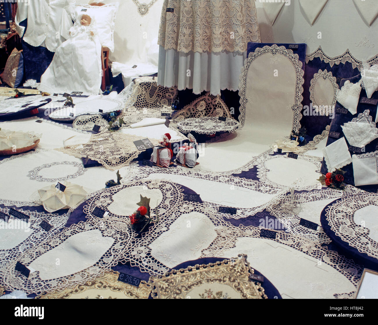 Lace products displayed for sale in a shop window, Bruges, Belgium ...