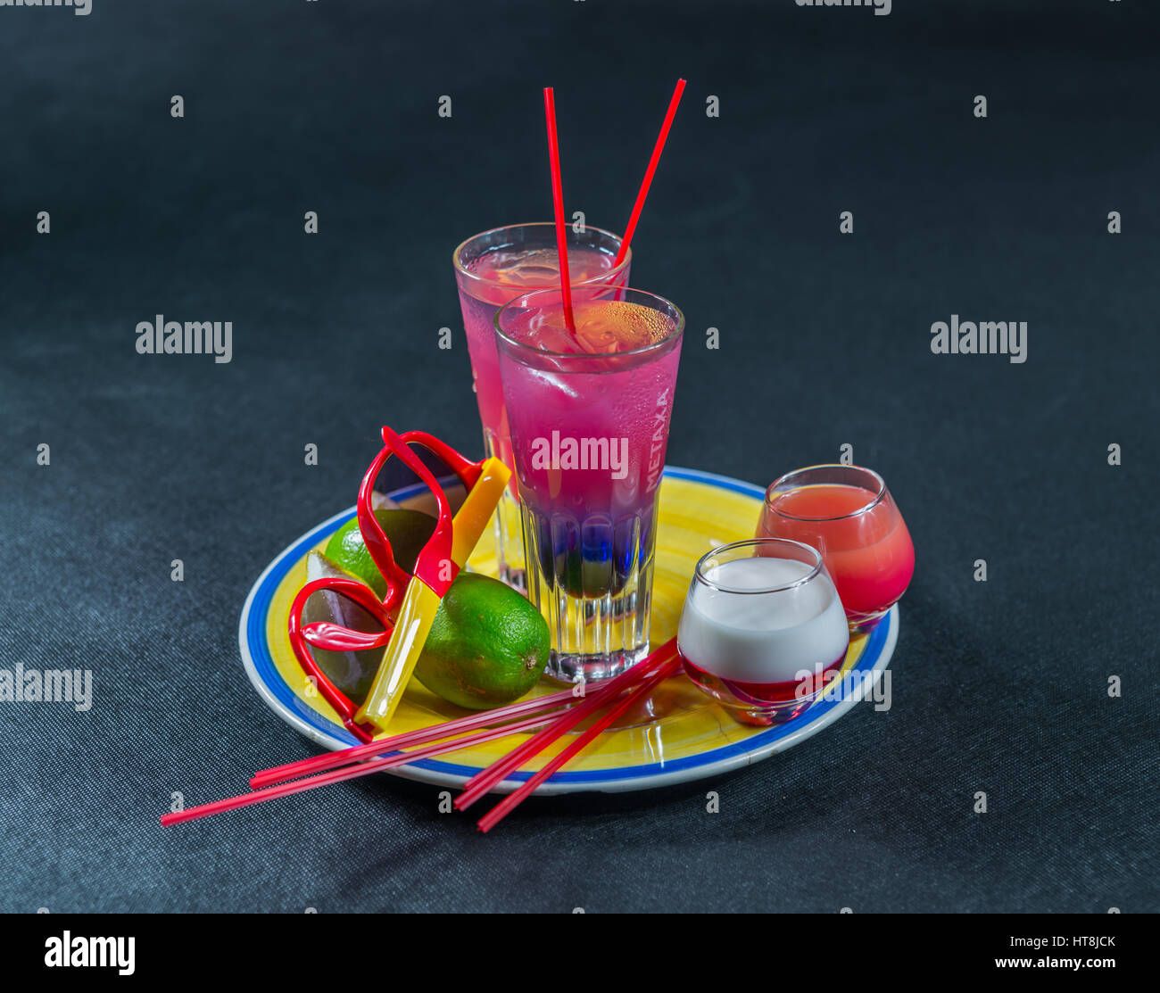 Two colored drinks, a combination of dark blue with purple, the second ...