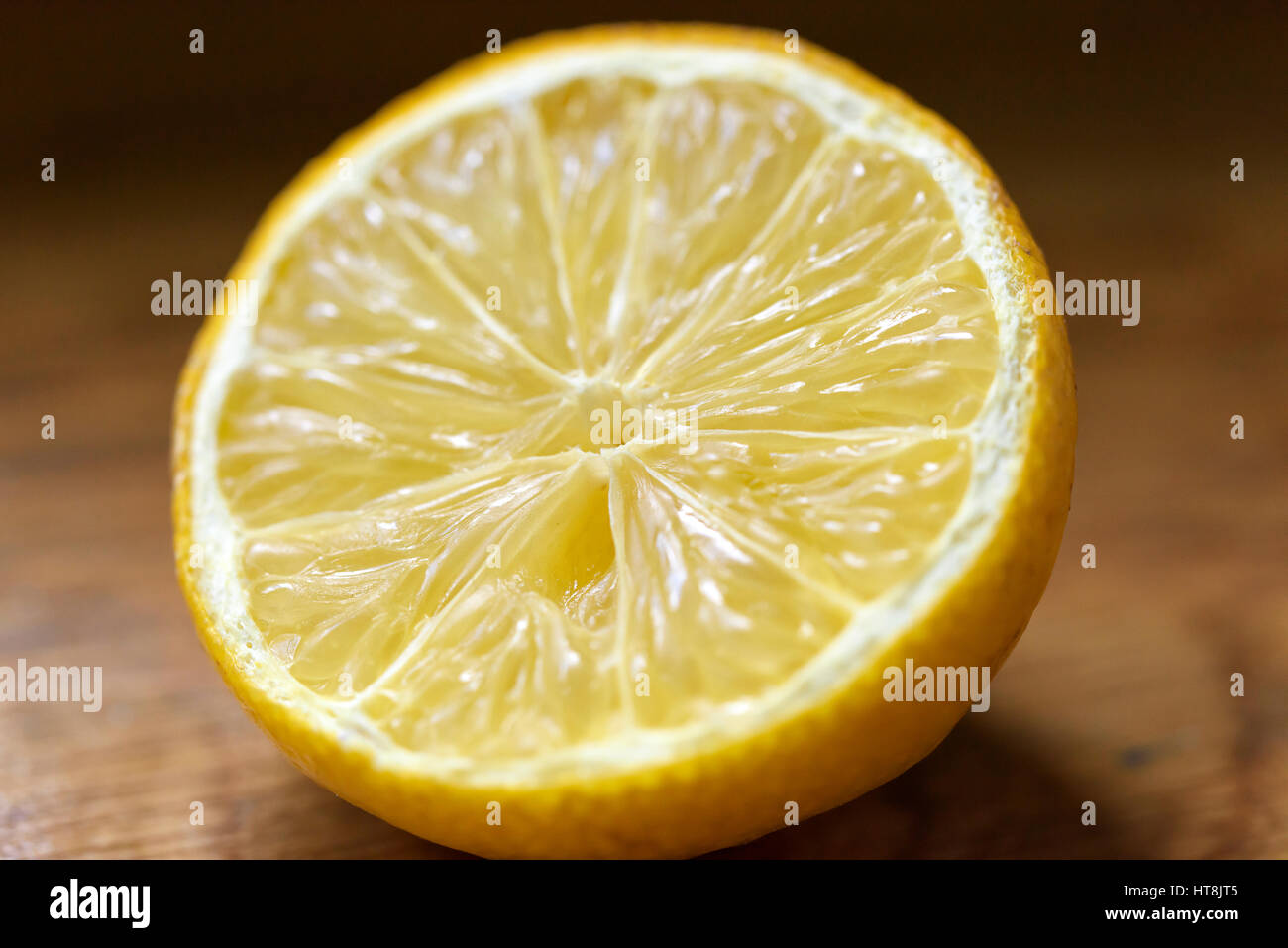 Close up macro photograph of half a lemon. This lemon is not fresh and ...