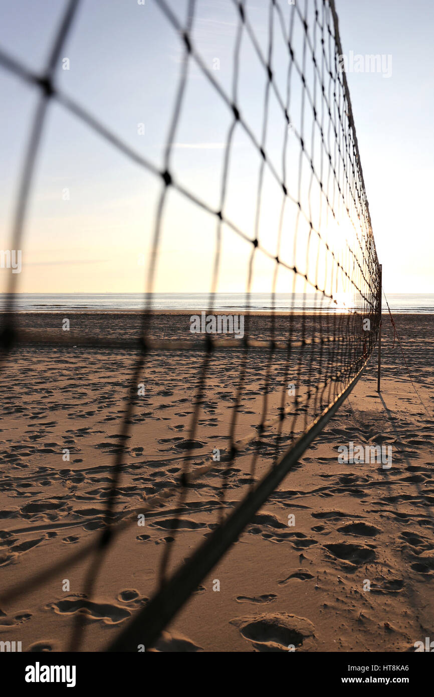 beach volleyball sand court at sunset Stock Photo - Alamy