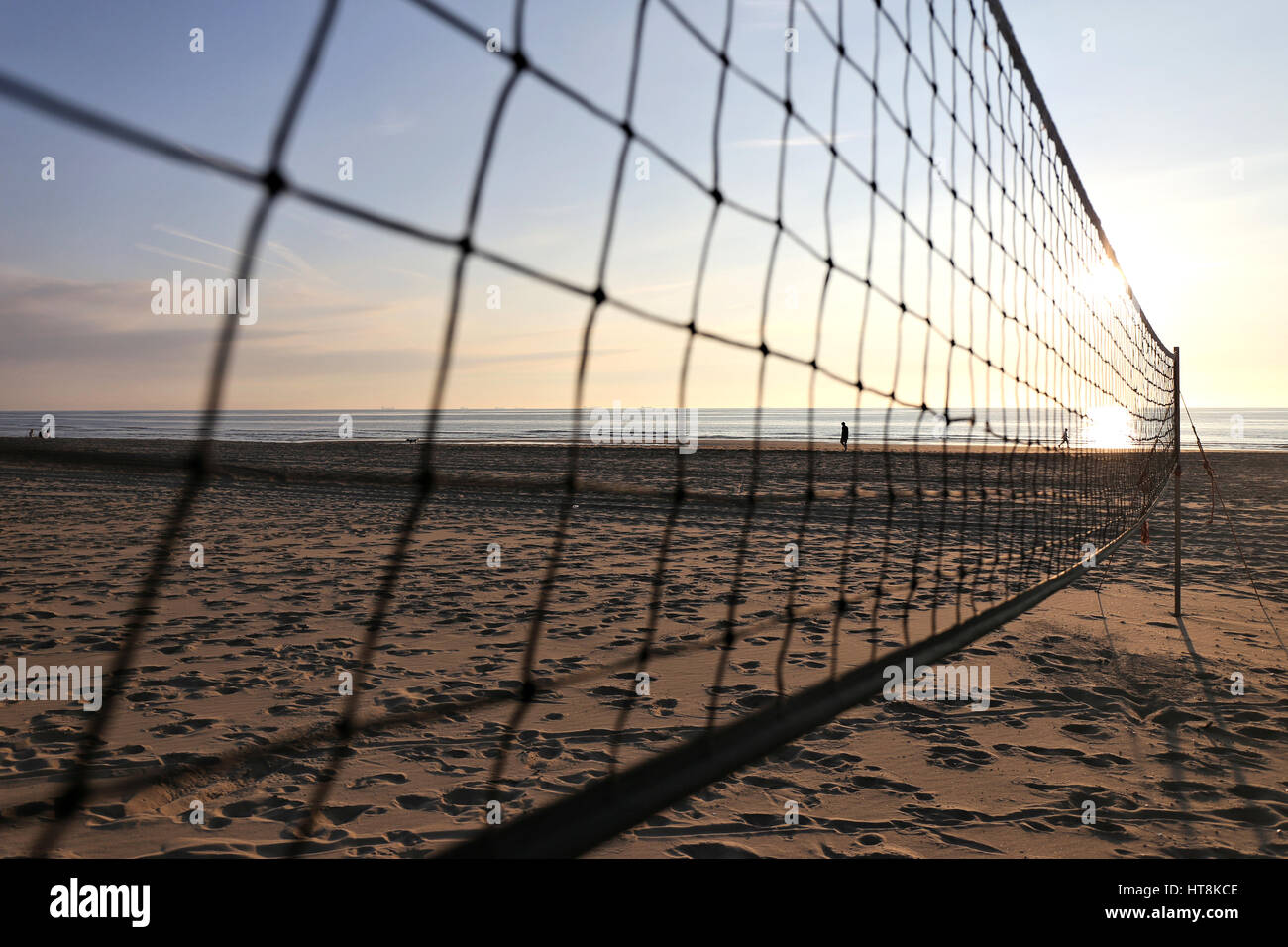 beach volleyball sand court at sunset Stock Photo - Alamy