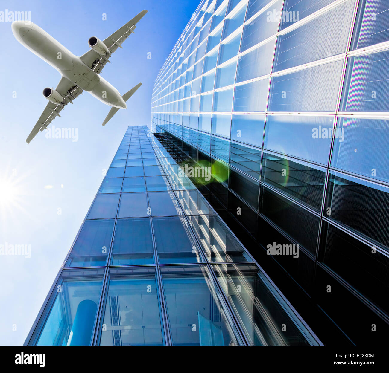 Airplane flying over business skyscrapers hi-res stock photography and ...