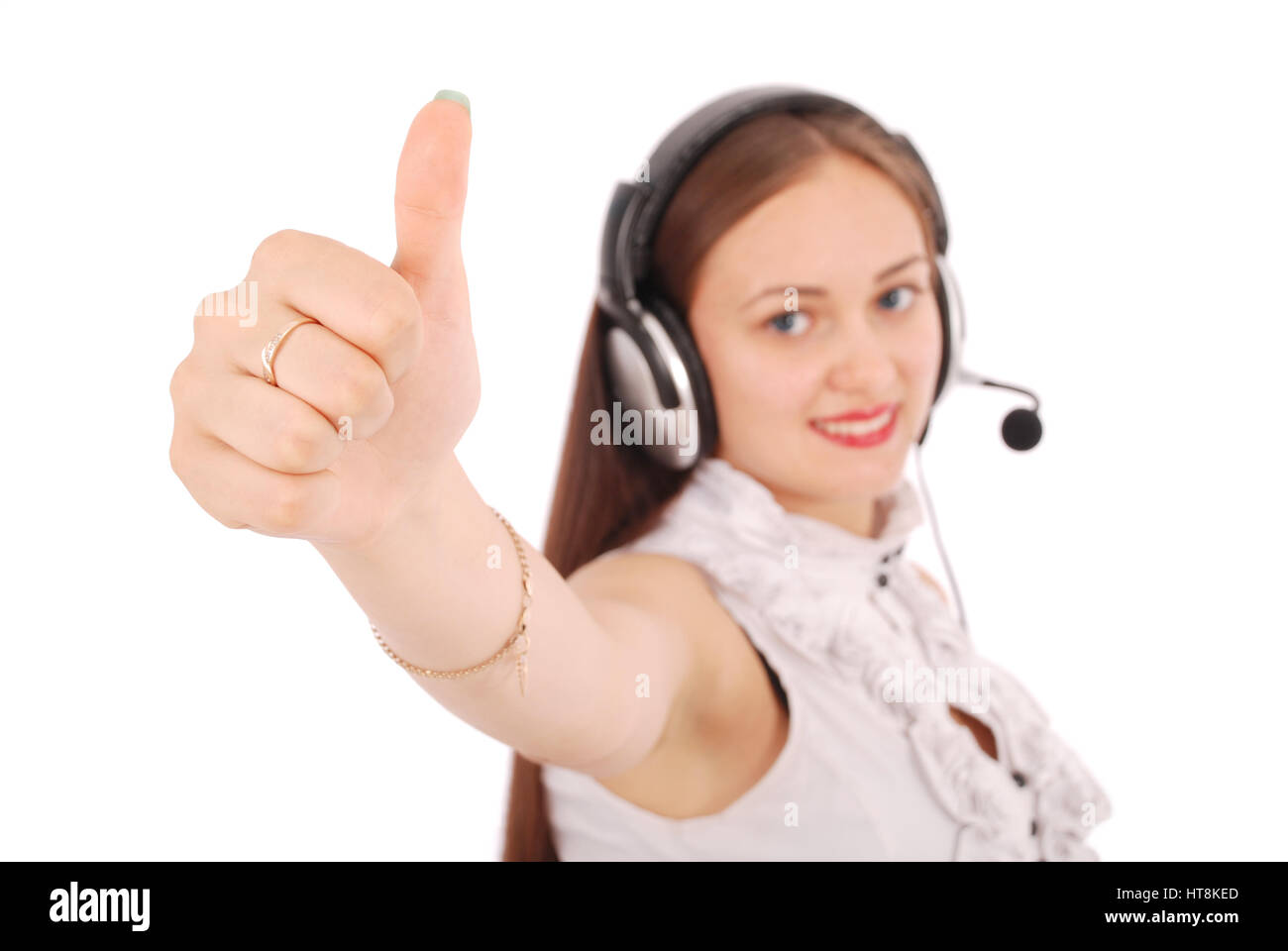 Pretty teenage girl listening music on her headphones isolated on white ...