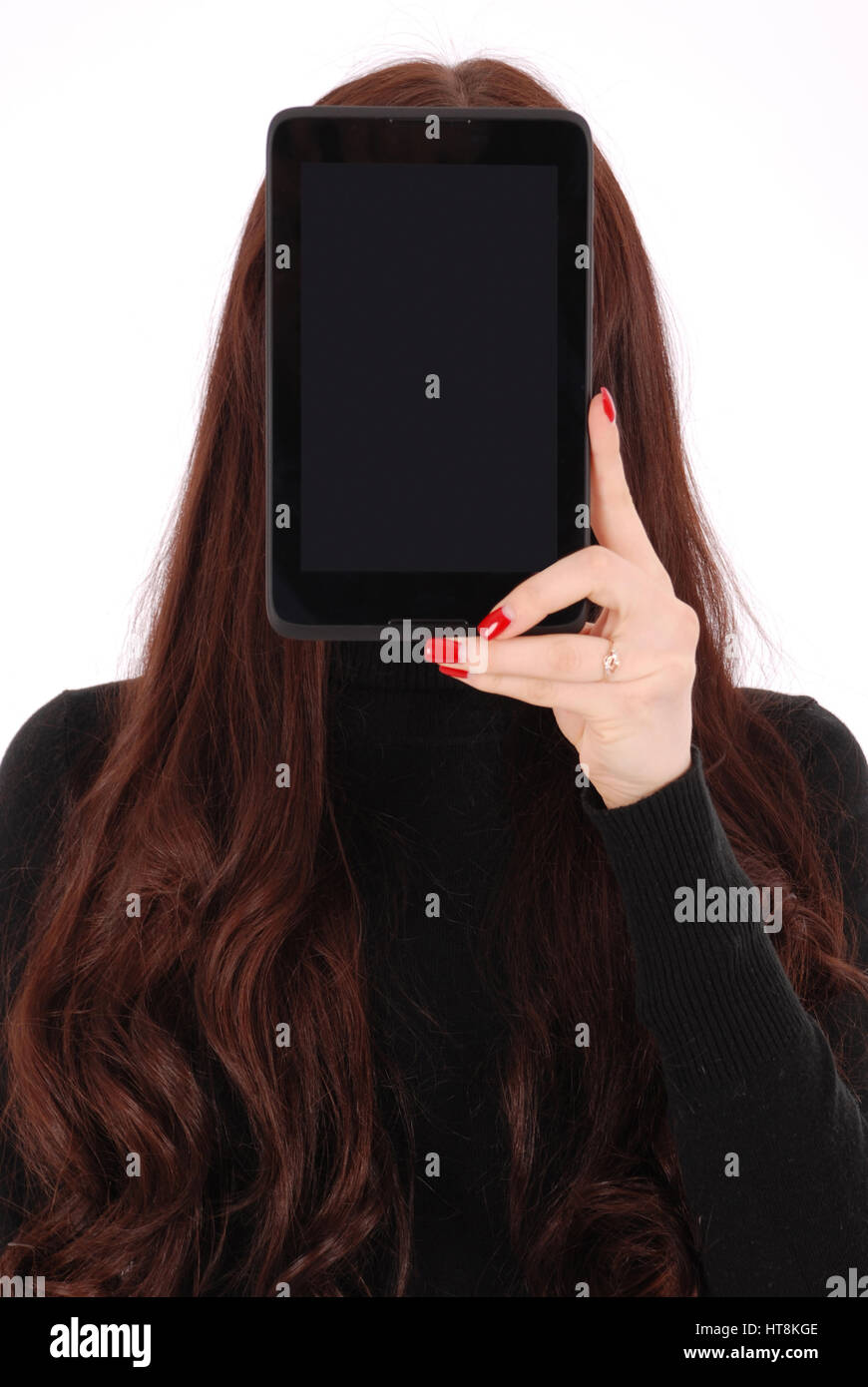 Girl keeps tablet pc the face isolated on white Stock Photo - Alamy