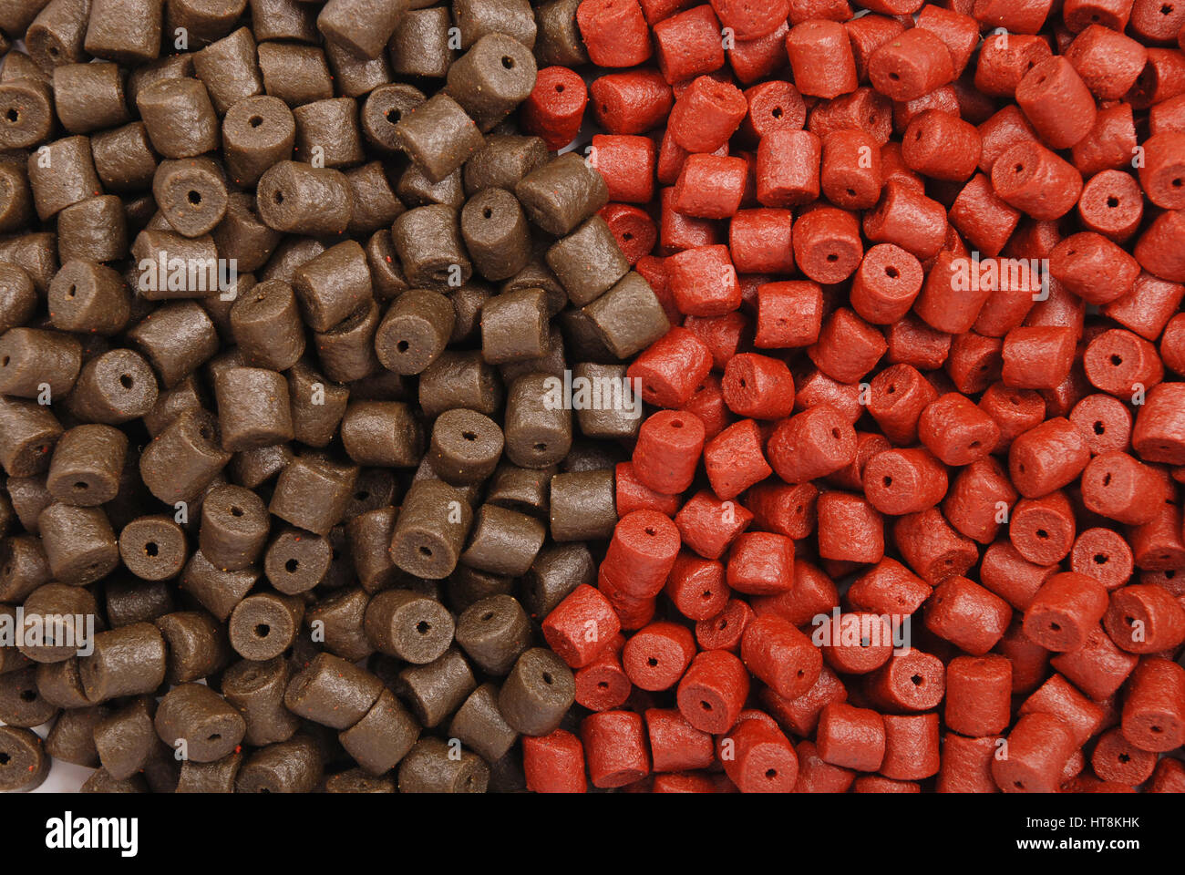 Brown with red pre-drilled halibut pellets for carp fishing background ...