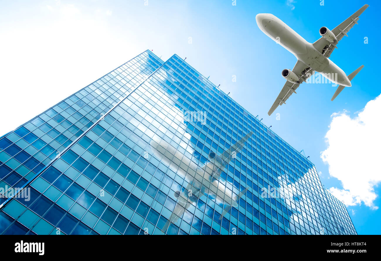 airplane with modern building. Jet over City Stock Photo - Alamy