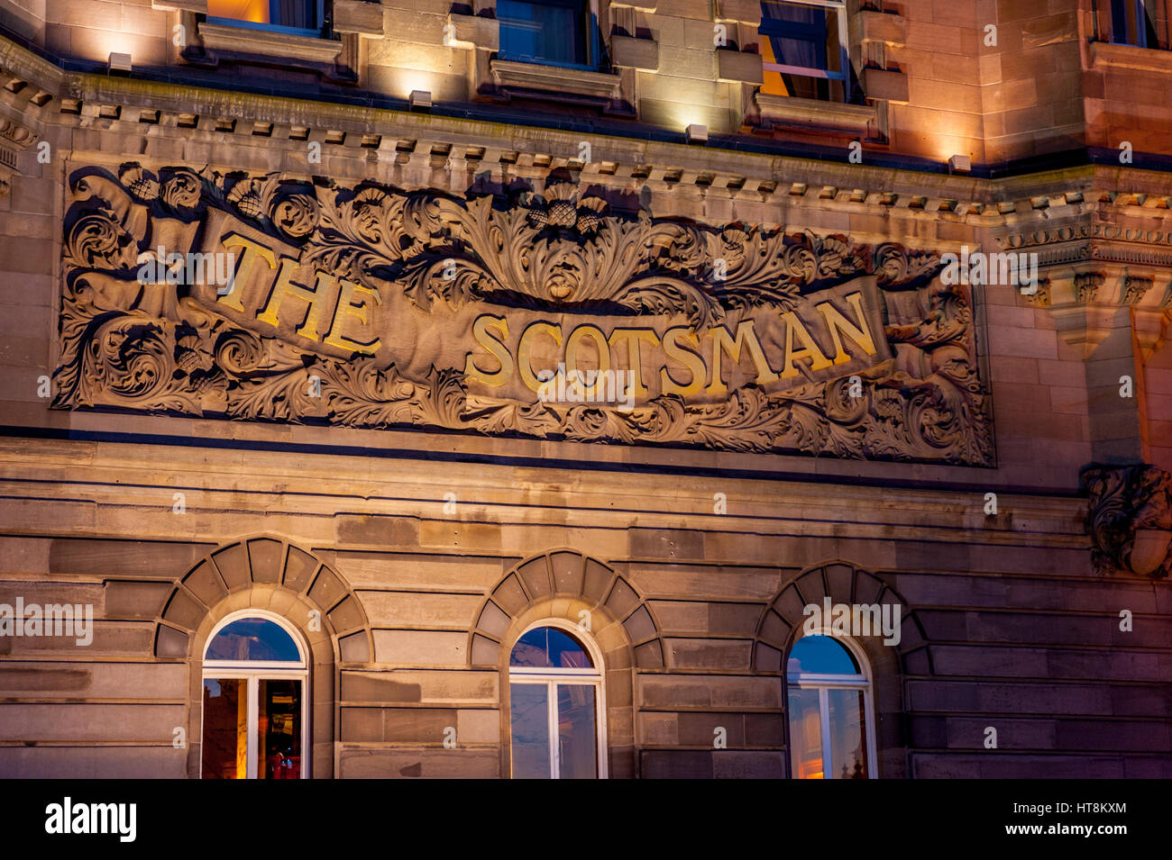 Sign on the old Scotsman newspaper building at night. The building is ...