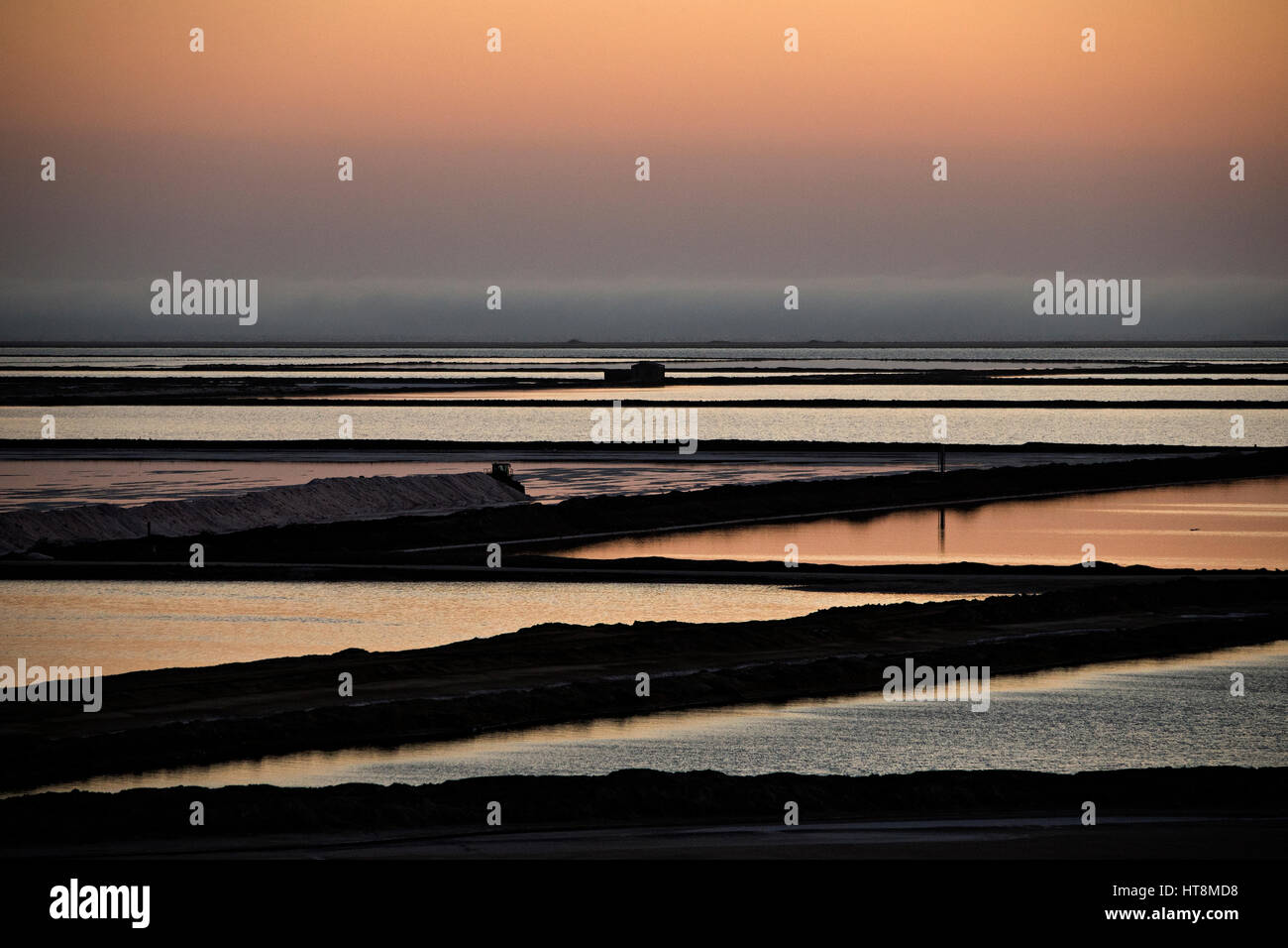 Sunset over salt evaporation ponds at Sandwich Harbour in Namibia Stock ...