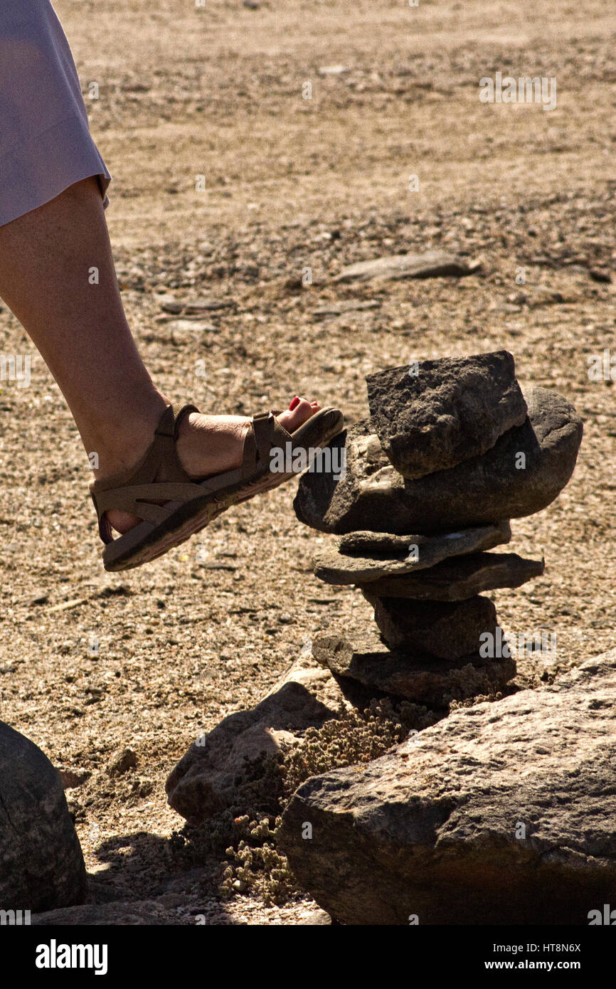 Kicking over rock graffiti left by tourists in Namibia Stock Photo - Alamy