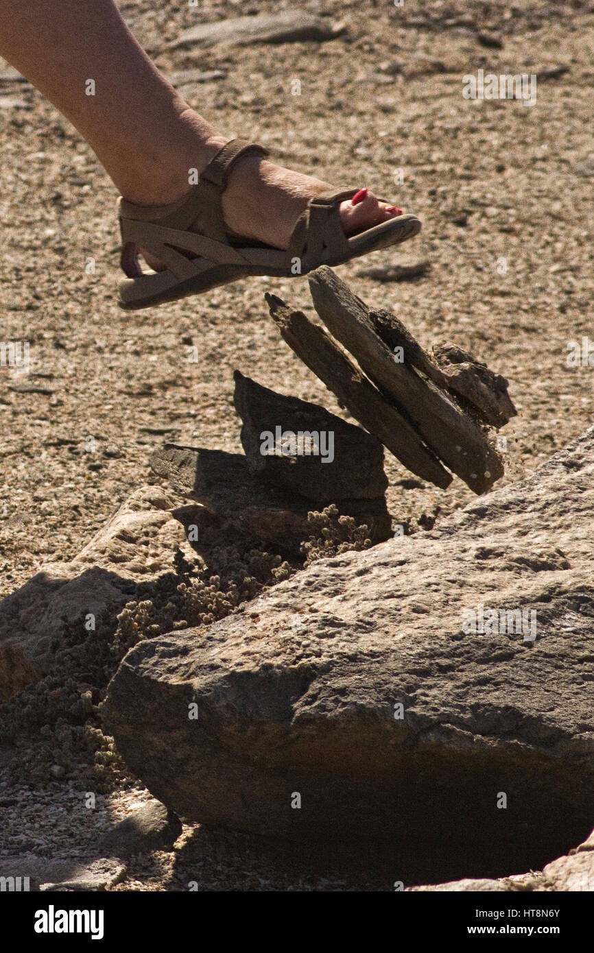 Kicking over rock graffiti left by tourists in Namibia Stock Photo - Alamy