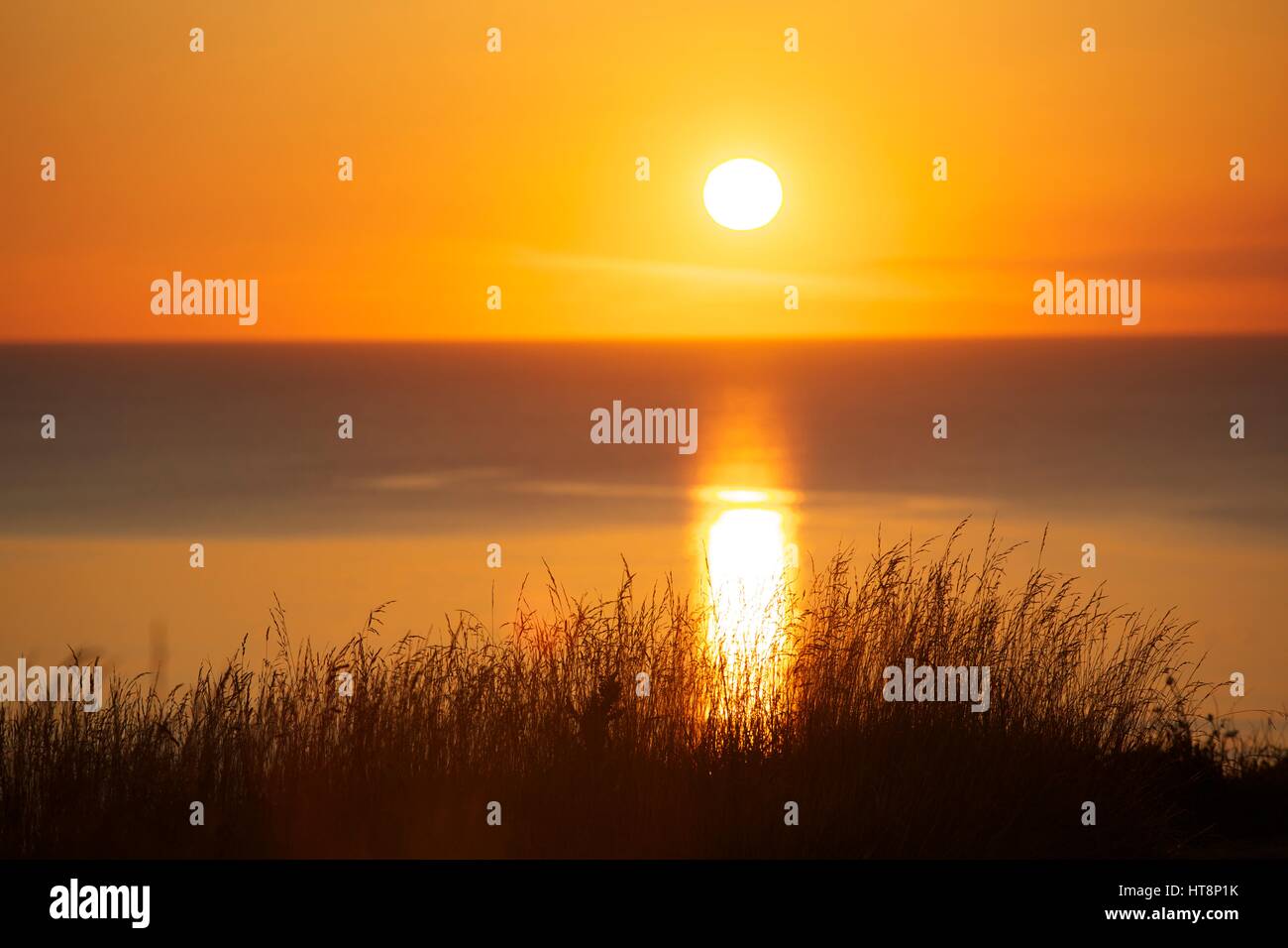 Sunset Over Sand Dunes Stock Photo - Alamy
