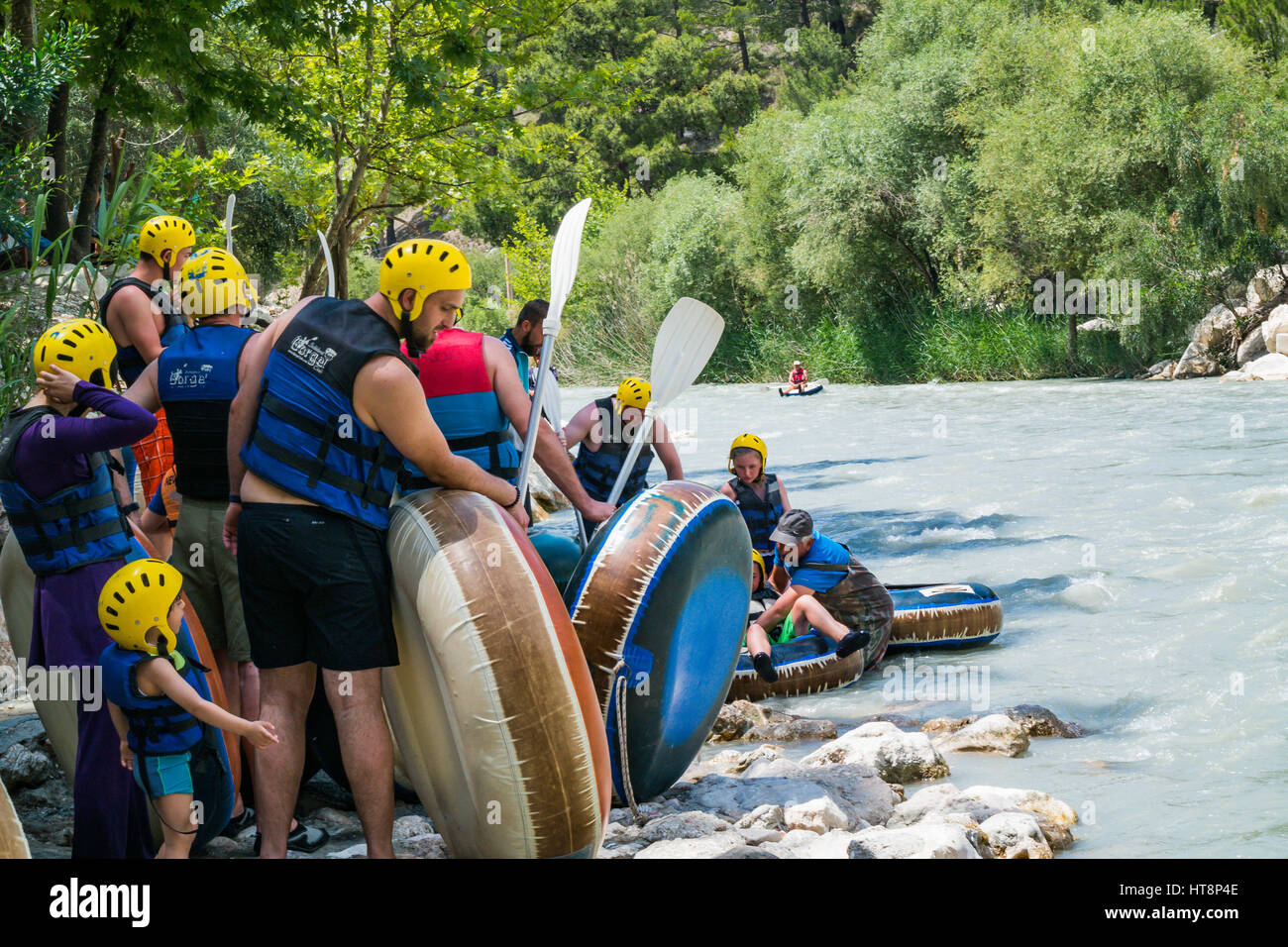 party waiting to start doing tubing on the rivers. young kid Stock ...