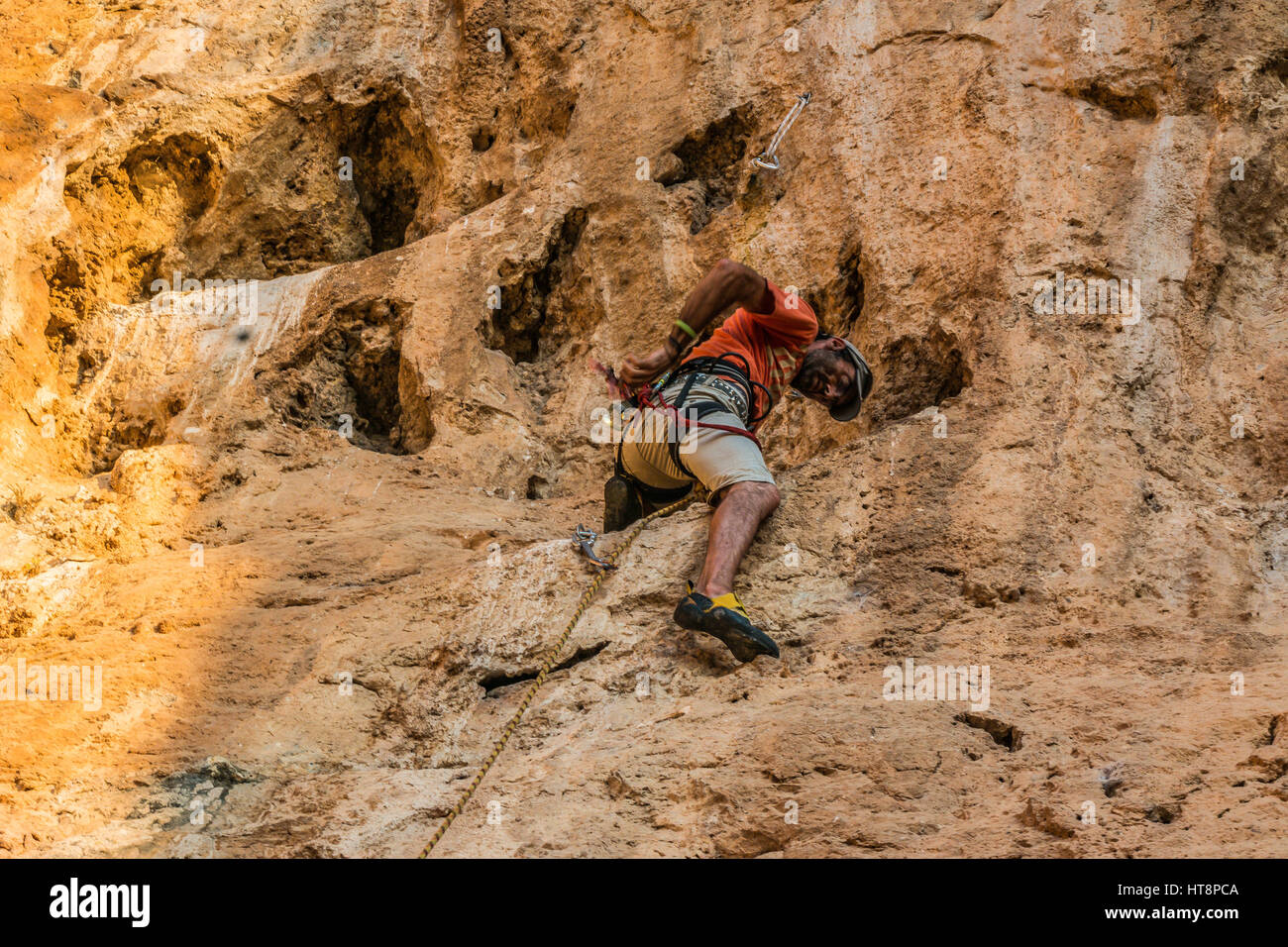 rock climbing man checking tools Stock Photo - Alamy