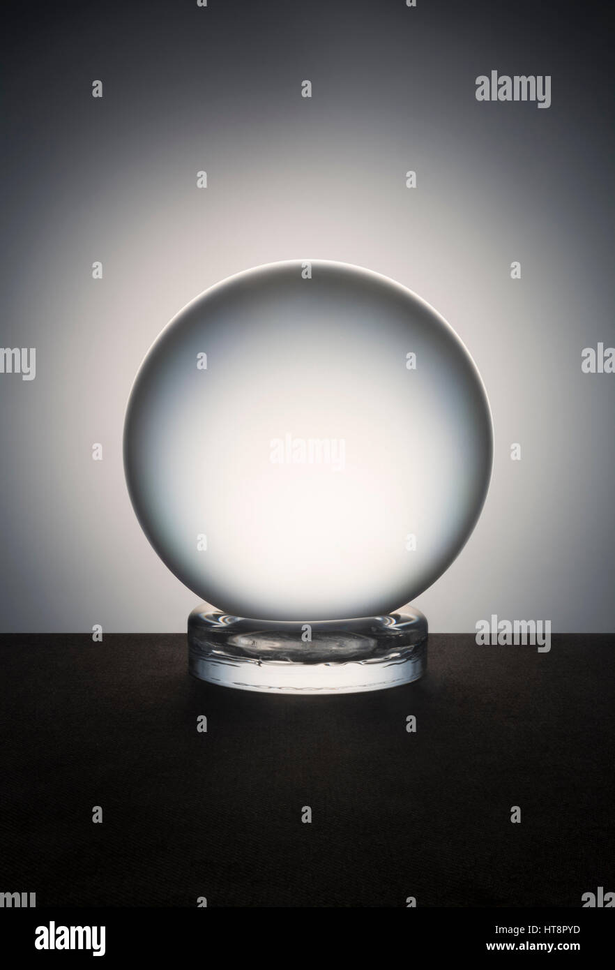 A large crystal ball against a plain background Stock Photo - Alamy