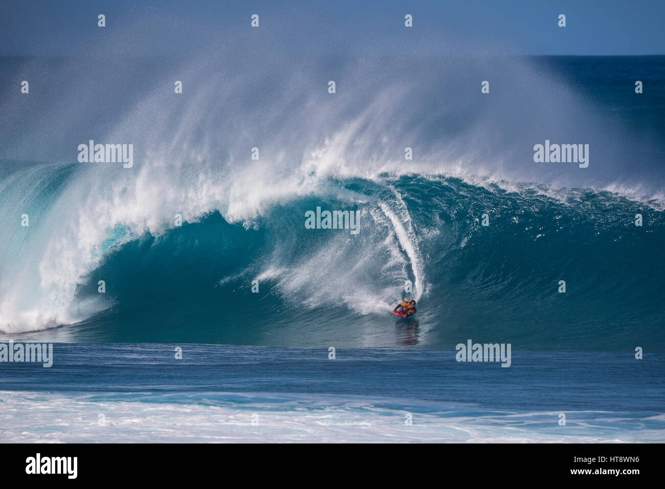 A body boarder catching a wave during a large swell at Pipeline on the ...
